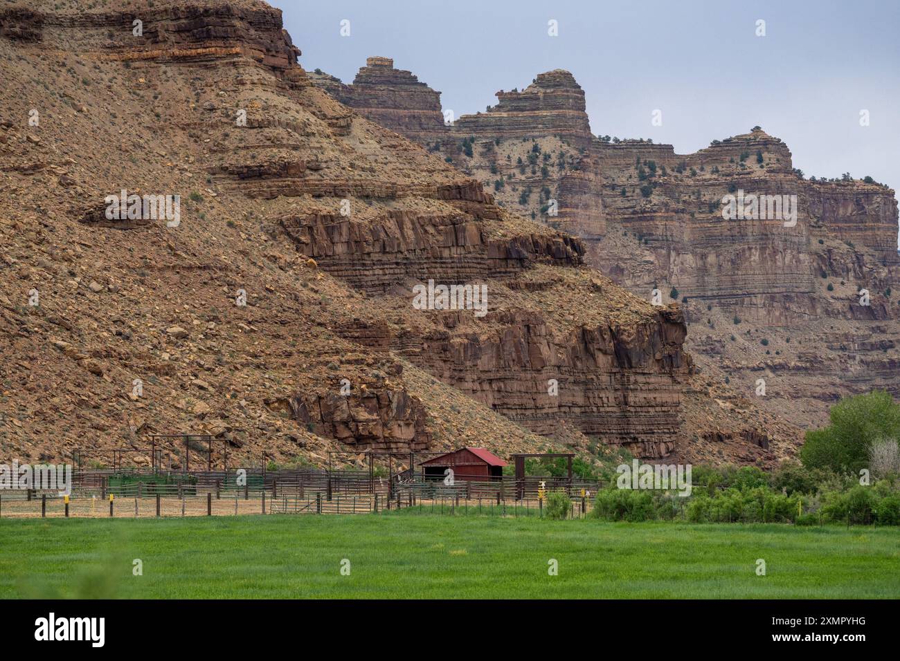 Livestock corrals on a cattle ranch surrounded by sandstone cliffs in ...