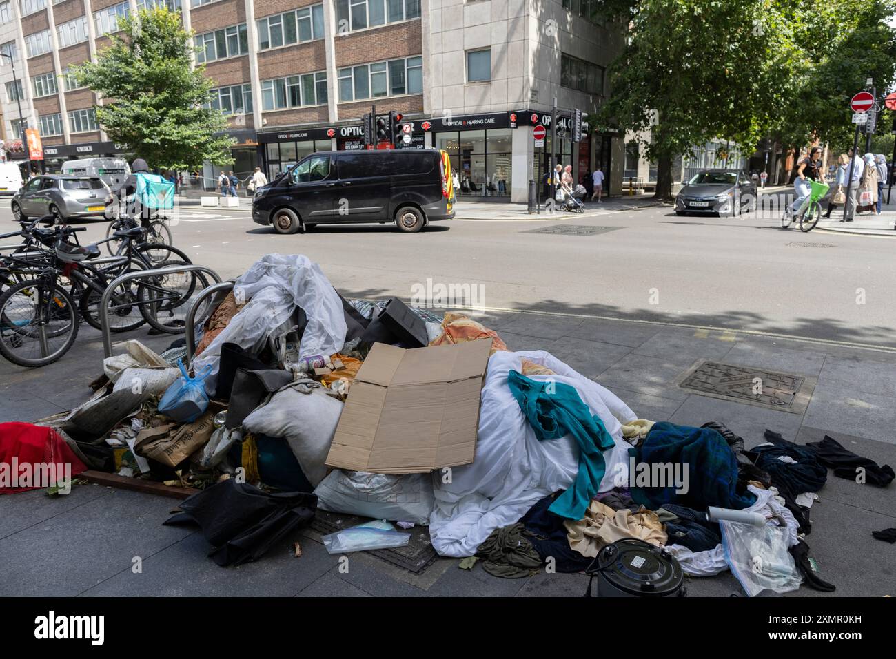 Piles of fly-tipped rubbish sit on the pavement along Tottenham Court ...