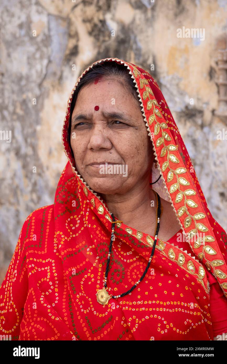Woman in traditional sari arrives at bathing ghat along sacred Puskar ...