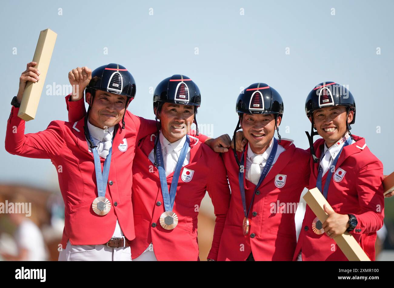 Team Japan celebrate their bronze medal in Equestrian Team Jumping ...