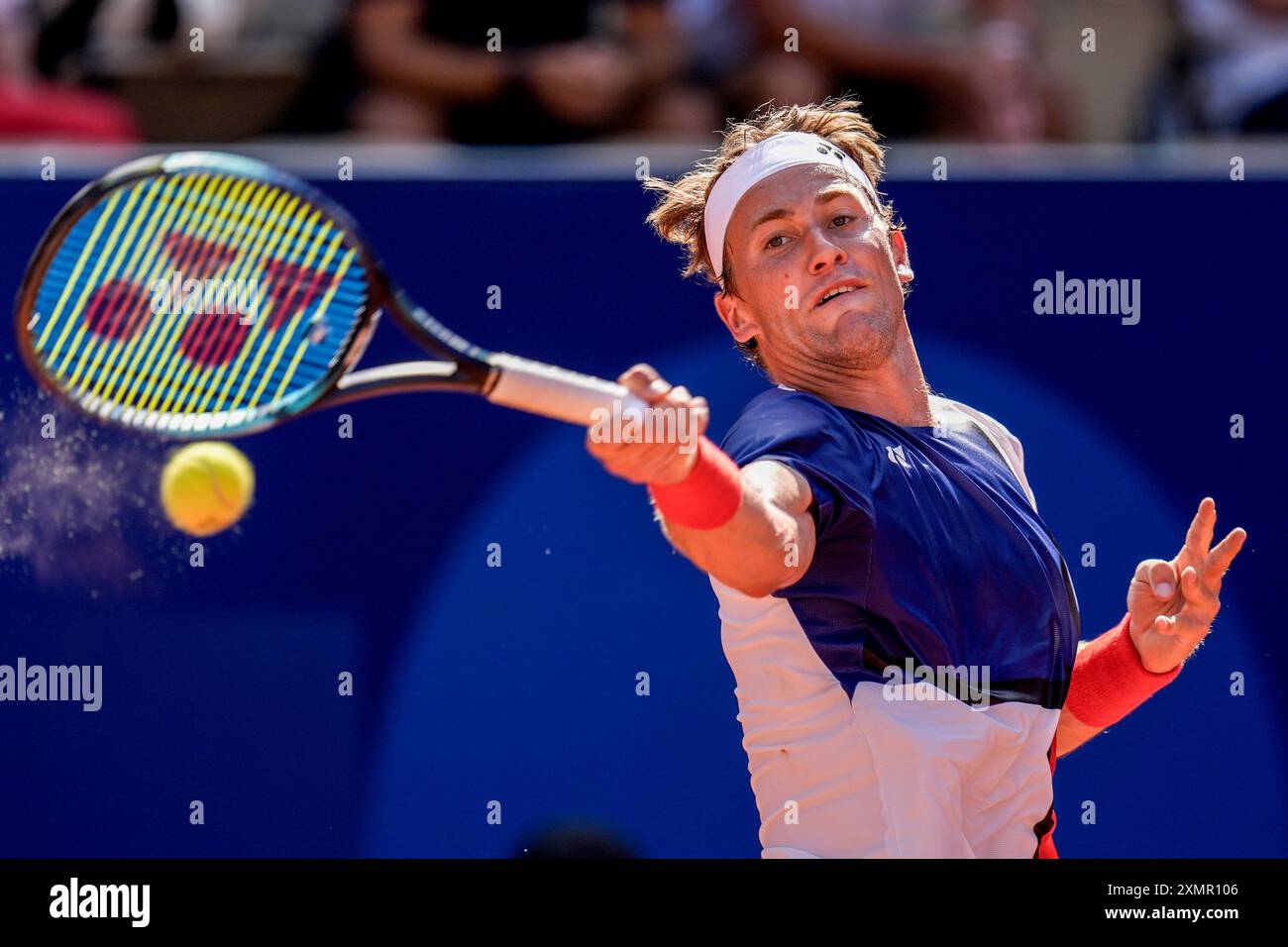 Casper Ruud of Norway returns the ball to Andrea Vavassori of Italy ...