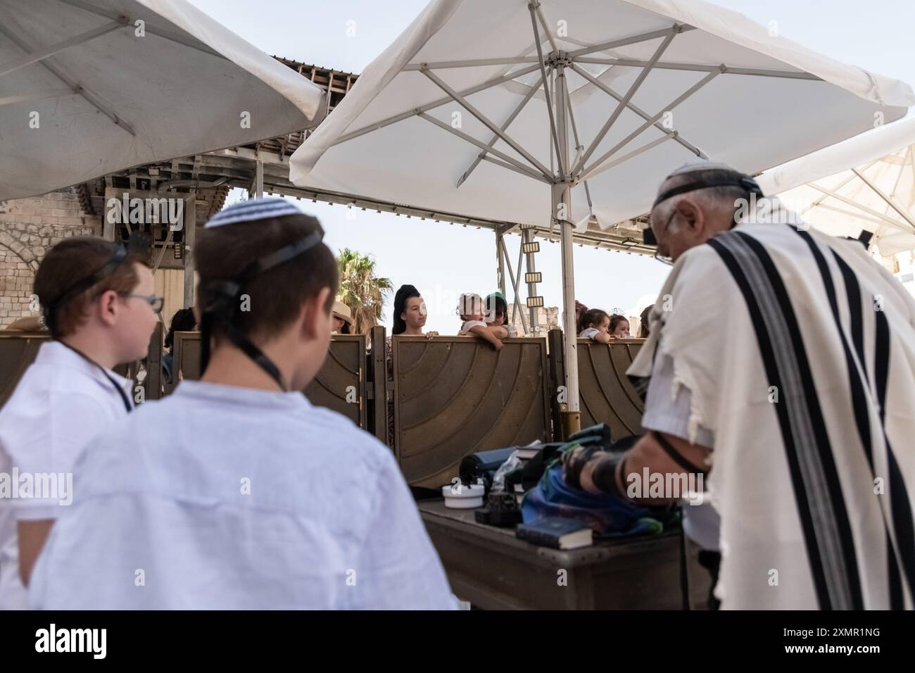 Jewish male worshippers prepare for a prayer at the Western Wall men ...