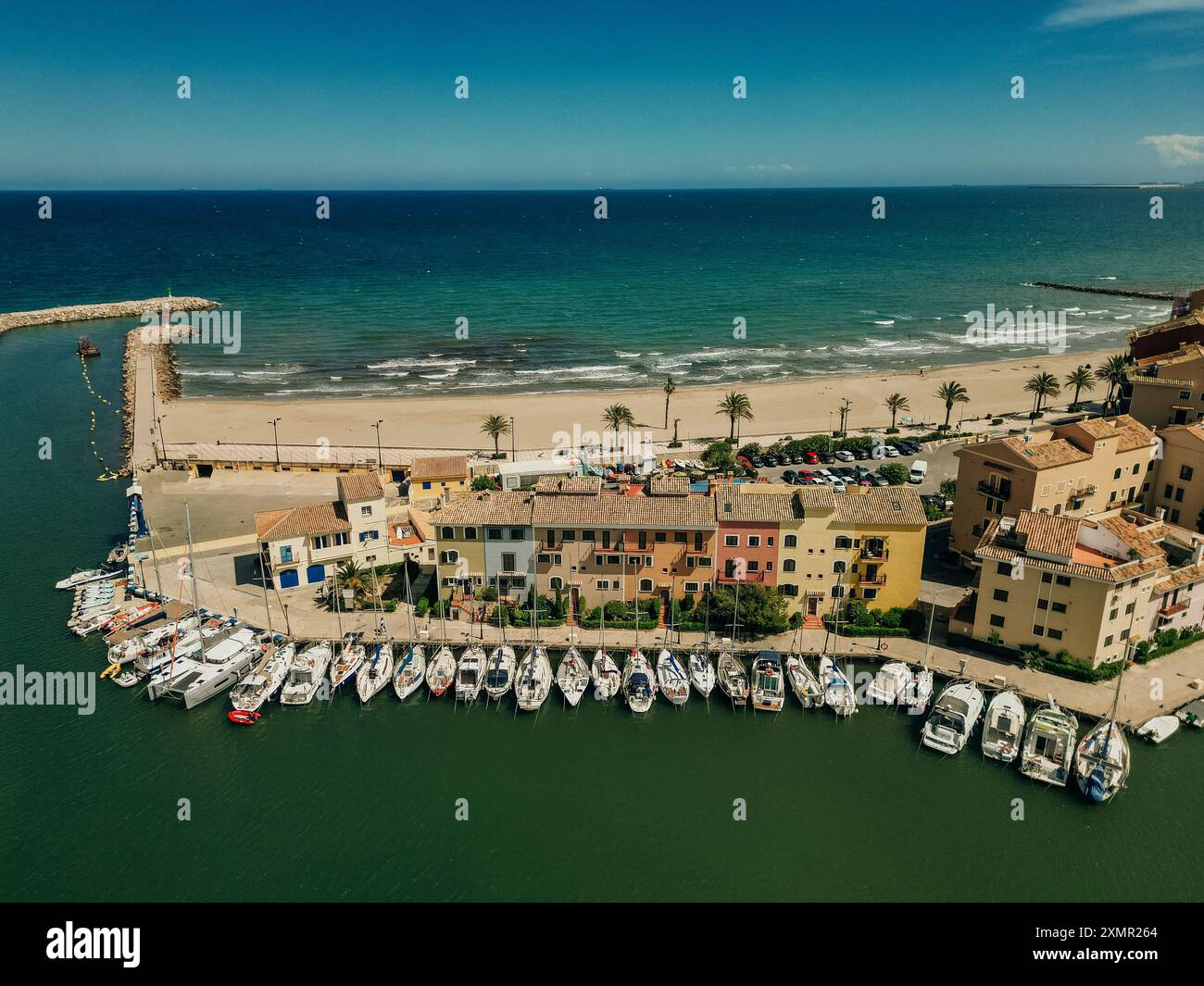 Colorful houses, buildings and yachts in Port Saplaya, Valencia's ...