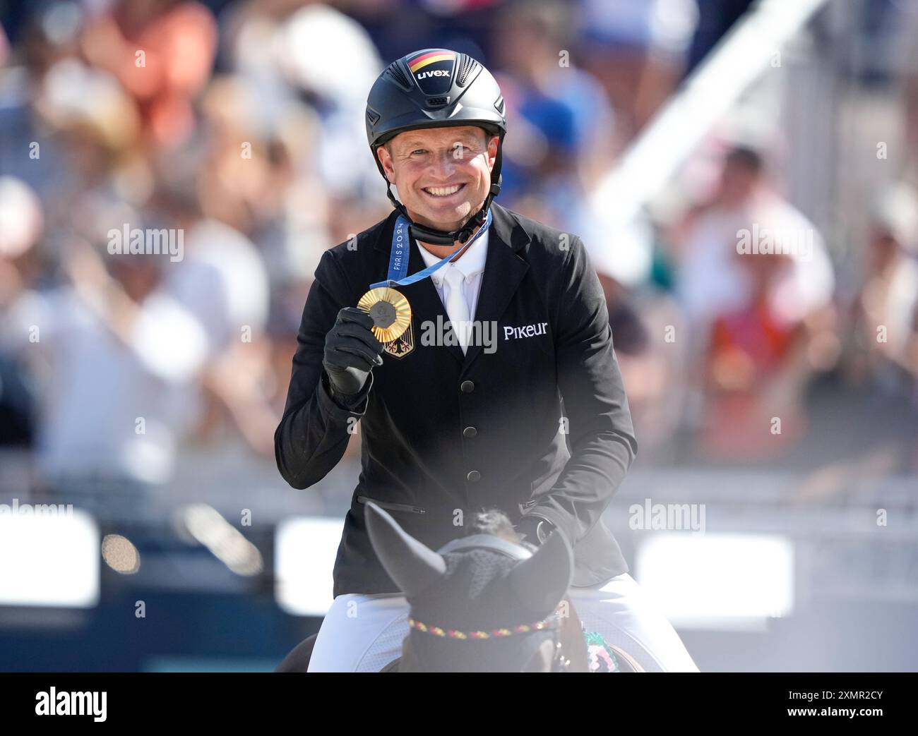 Germany's Michael Jung, riding Fischer Chipmunk, celebrates his gold ...