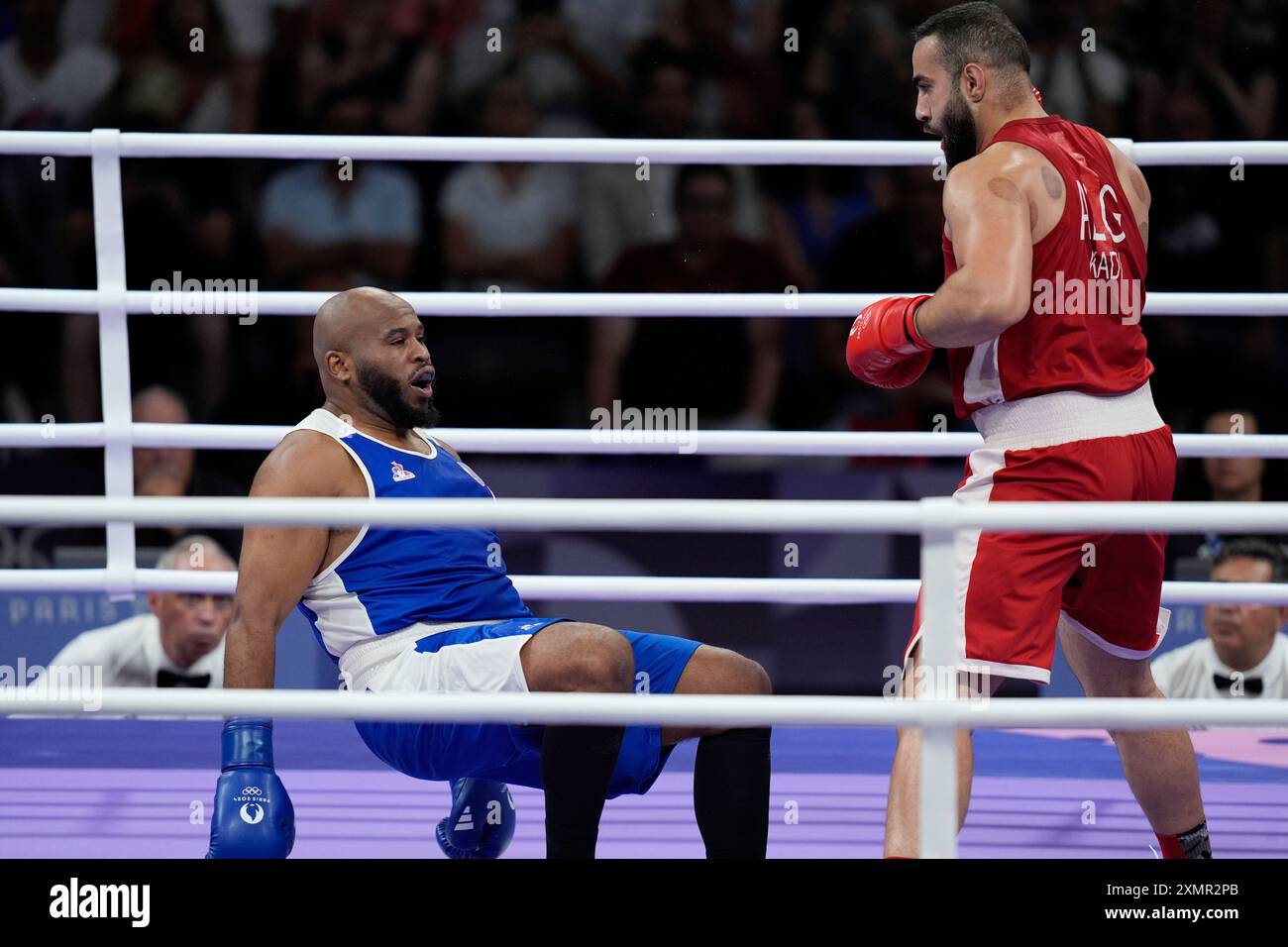 Algeria's Mourad Kadi knocks down France's Djamili-Dini Aboudou in ...