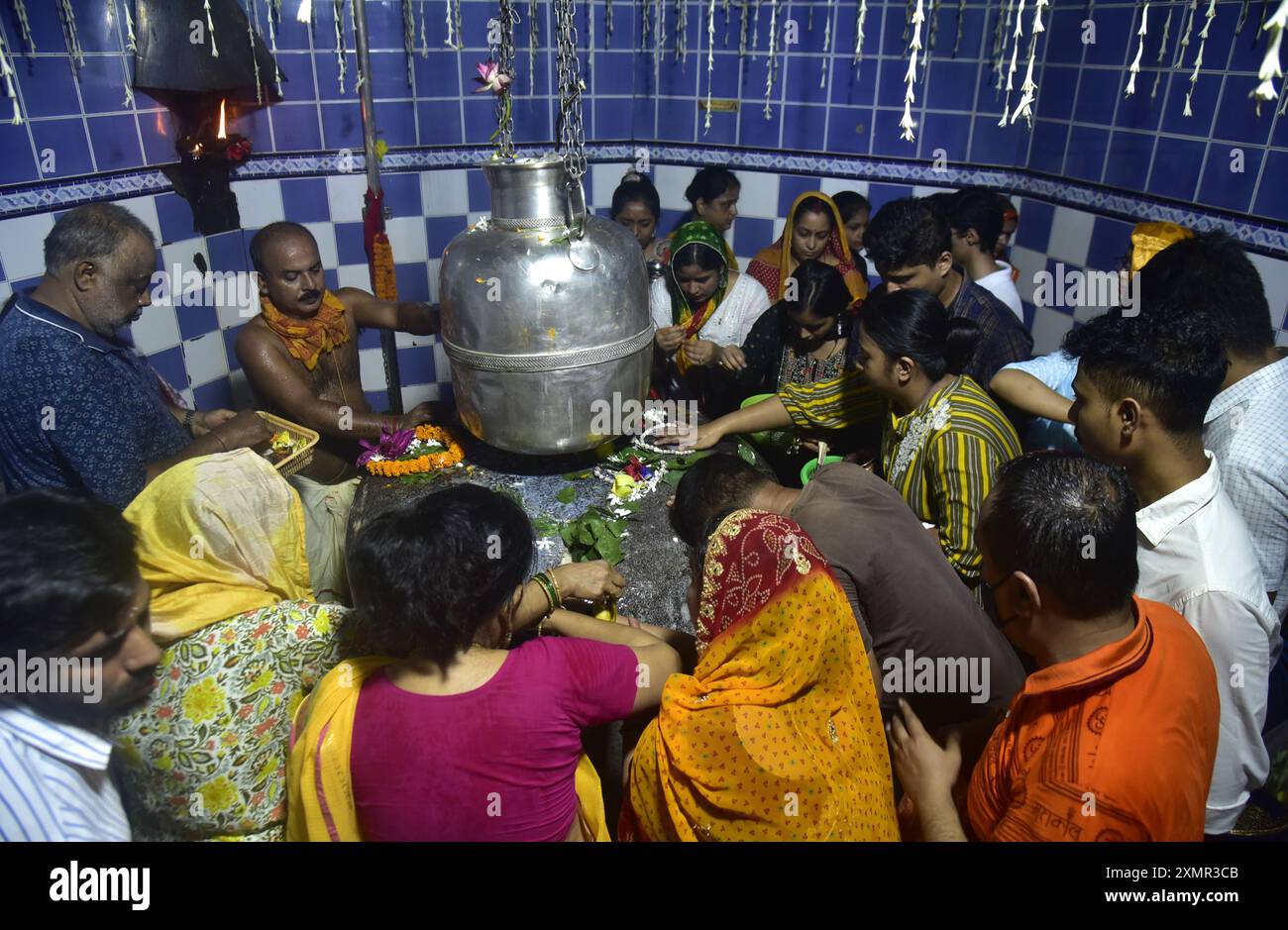 Guwahati, Guwahati, India. 29th July, 2024. Devotees offer prayer on ...