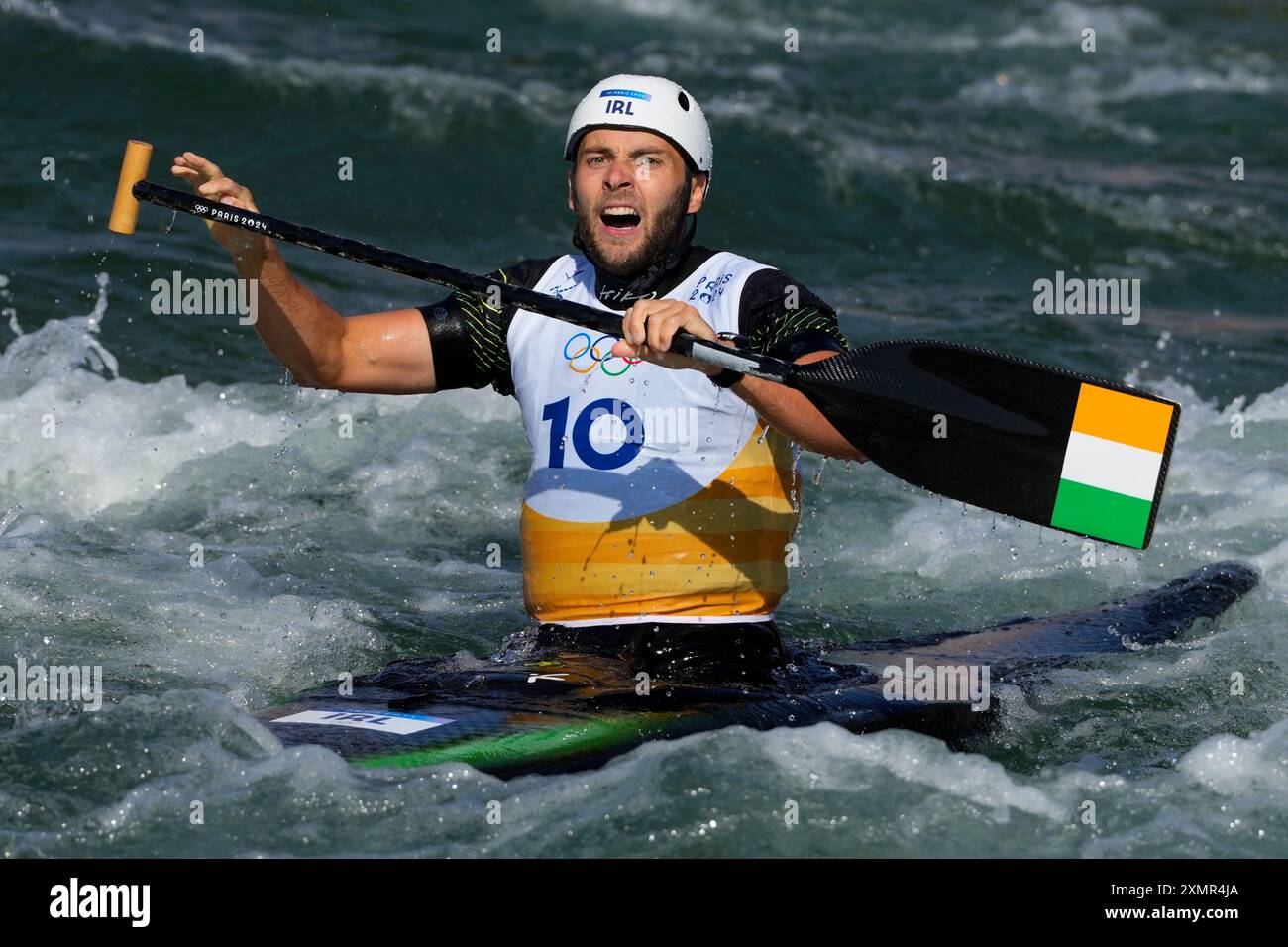 Liam Jegou of Ireland reacts at the finish line of the men's canoe ...