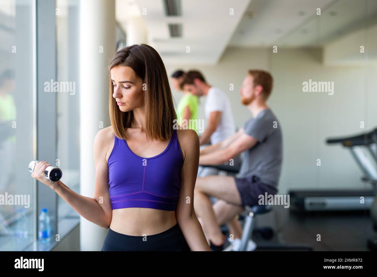 Fitness woman. Fit fitness girl smiling happy lifting weights looking ...