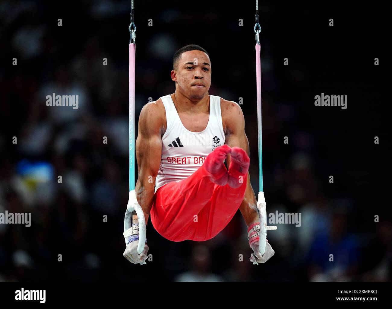 Great Britain's Joe Fraser performs on the rings during the Men's Team ...