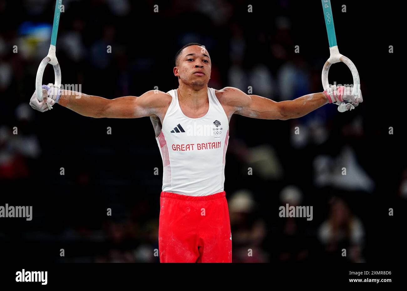 Great Britain's Joe Fraser performs on the rings during the Men's Team ...