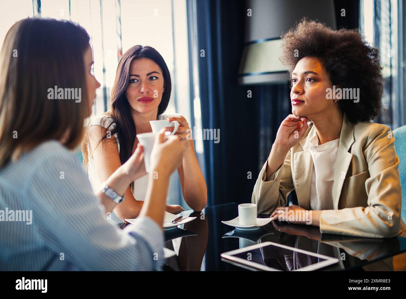 Business woman and her clients discuss business ideas and collaborate ...