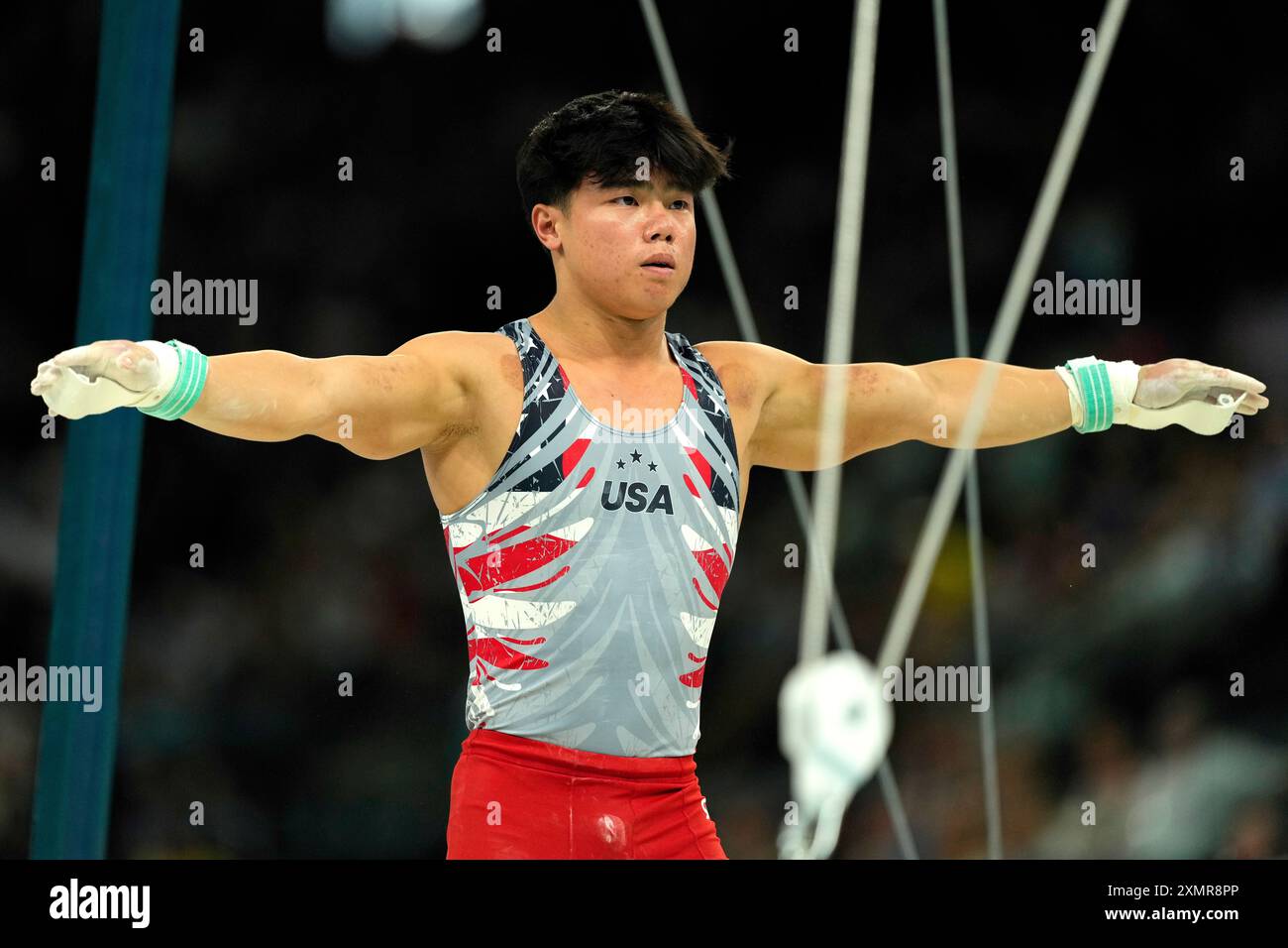 Asher Hong, of the United States, performs on the rings during the men ...