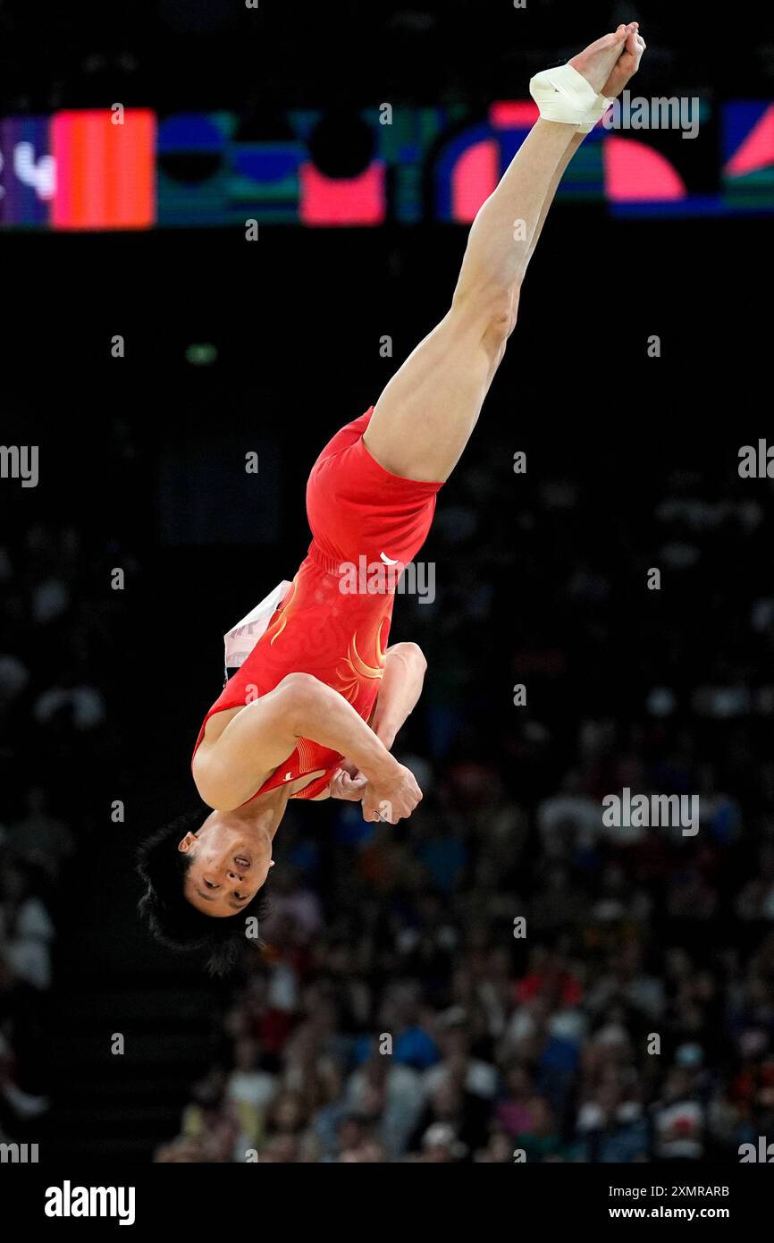 Sun Wei, of China, performs in the floor exercise during the men's ...