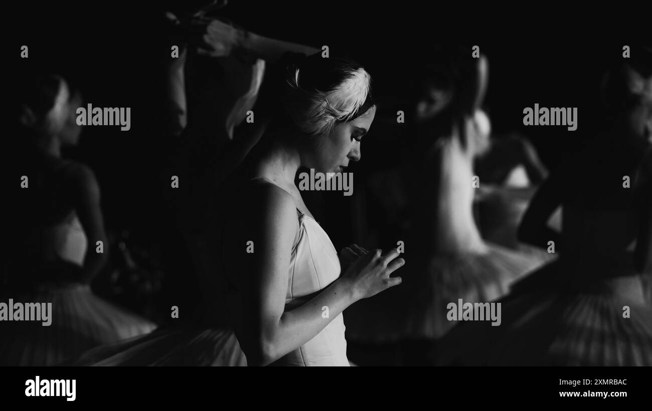 Ballerinas in white tutus, view from backstage. Black and white photos ...