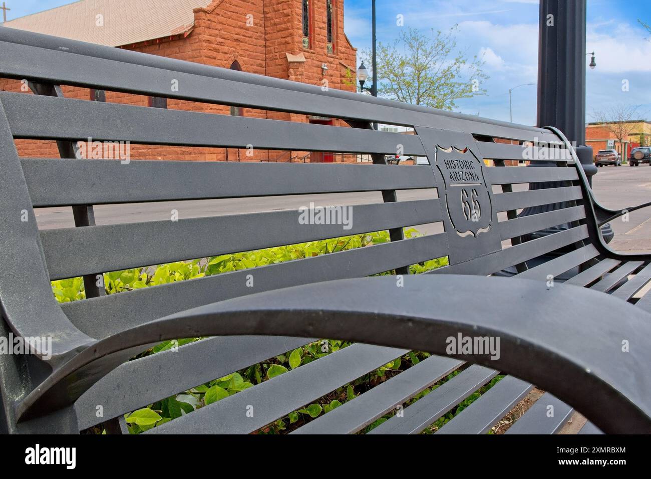 Close up park bench adored with Historic Route 66 shield in downtown ...