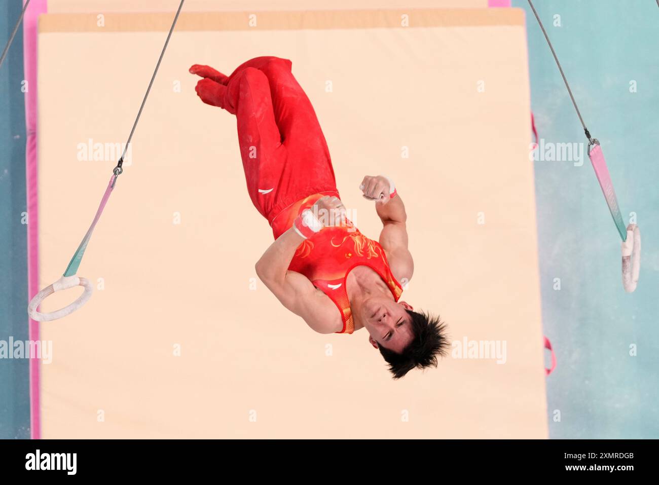 Zhang Boheng of China performs on the rings during the men's artistic ...