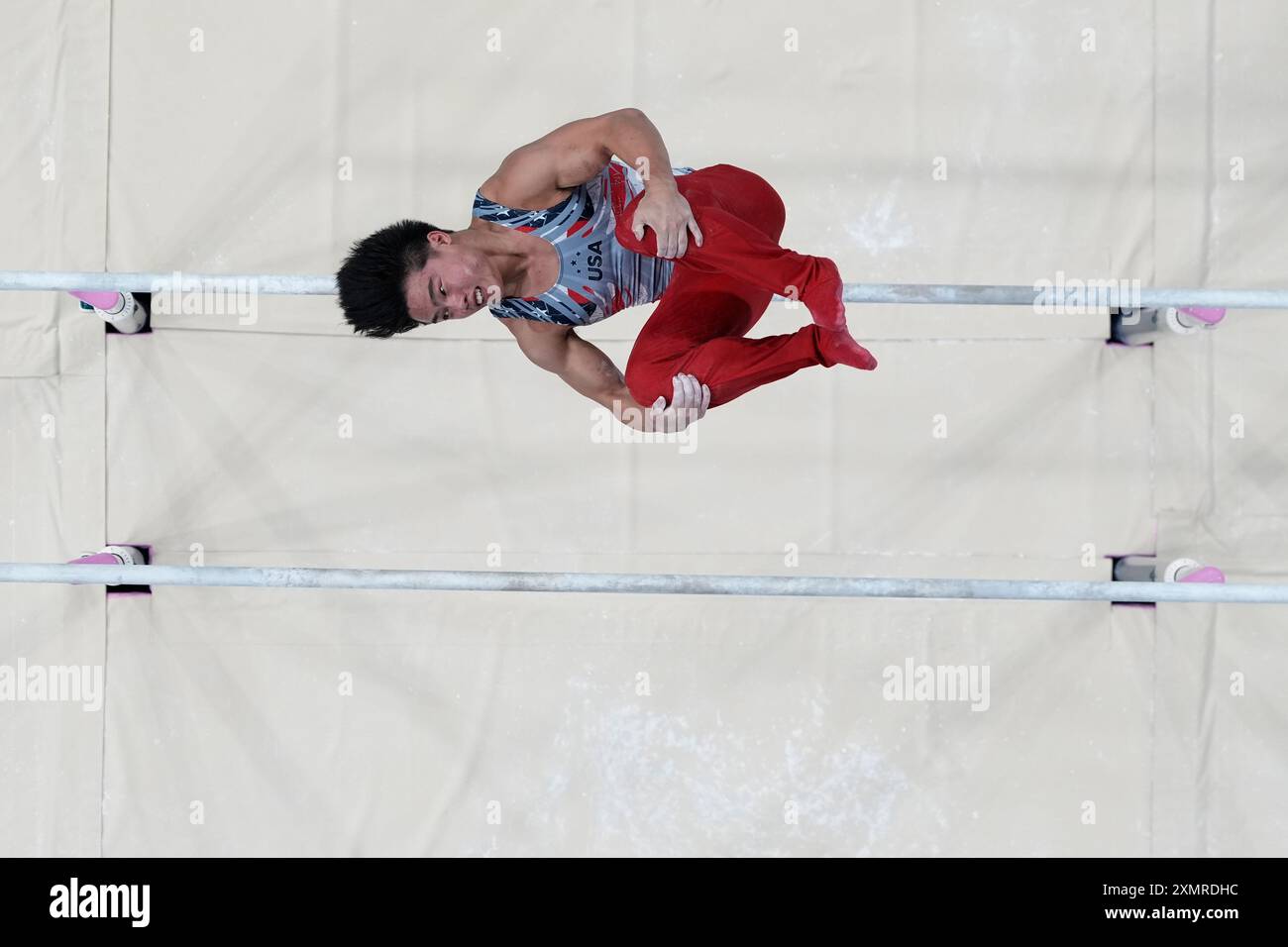 Asher Hong of the United States performs on the parallel bars during ...