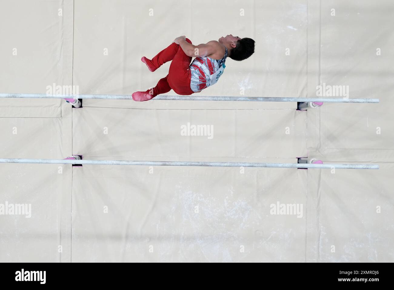 Asher Hong of the United States performs on the parallel bars during ...