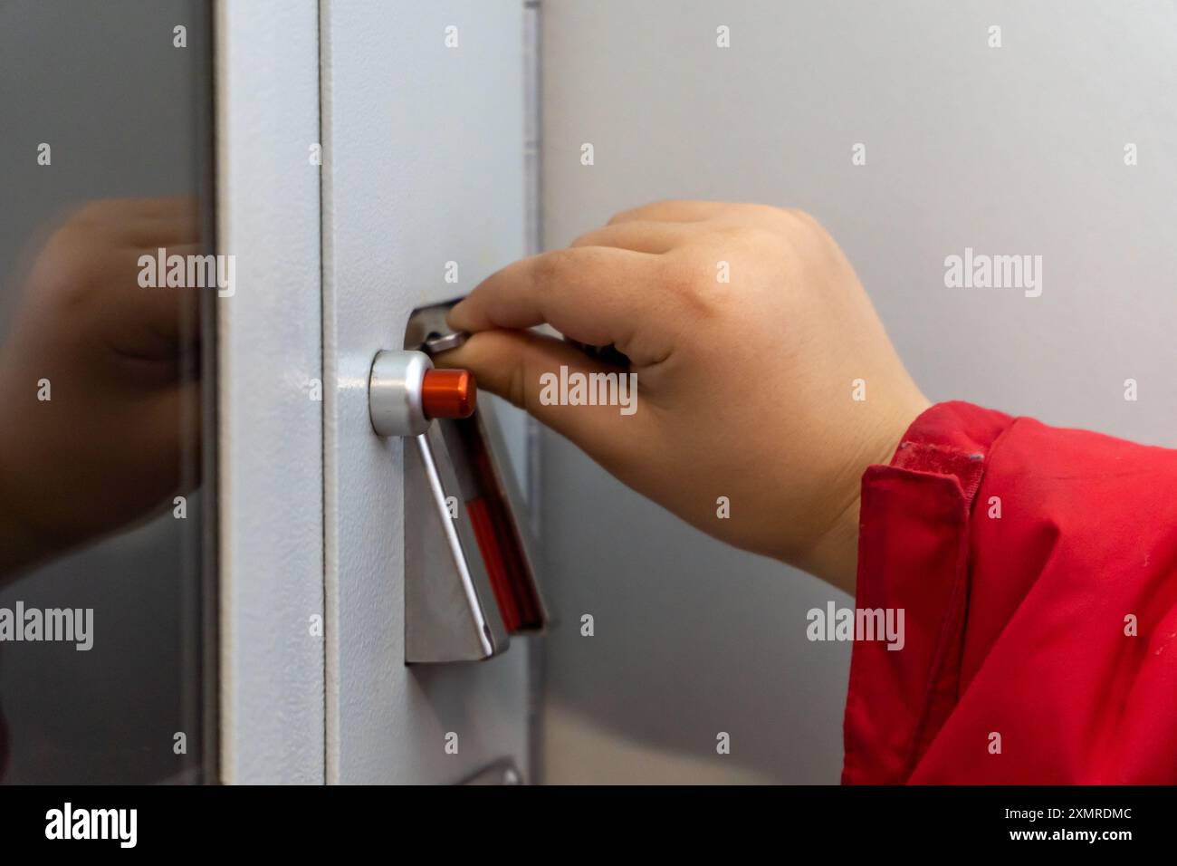 Child putting coin inside the slot of a retro vending machine Stock ...