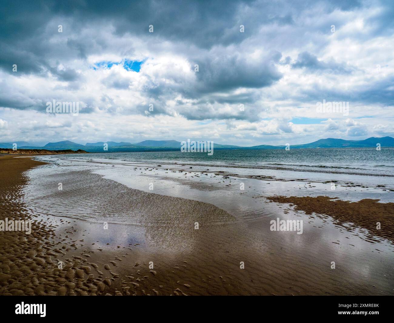 Snowdonia (Eryri) National Park from the sandy beaches of the Isle of ...