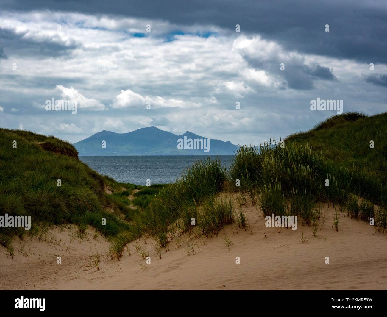 Snowdonia (Eryri) National Park from the sandy beaches of the Isle of ...