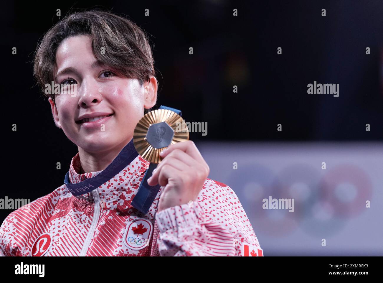 Paris, France. 29th July, 2024. Canada's Christa Deguchi holds her gold medal after her win in ...