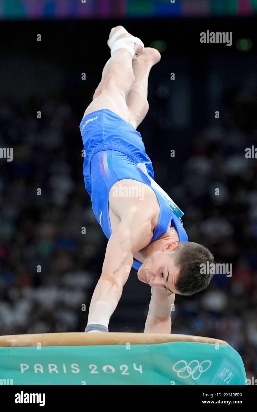Mario MacChiati, of Italy, performs on the vault during the men's ...