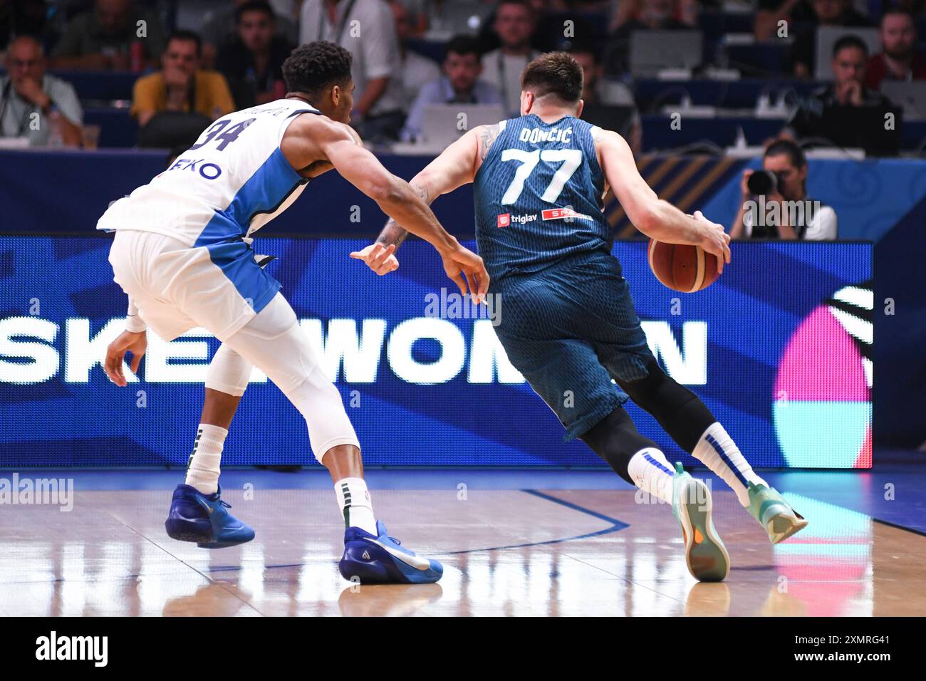 Luka Doncic (Slovenia) guarded by Giannis Antetokounmpo (Greece). FIBA ...