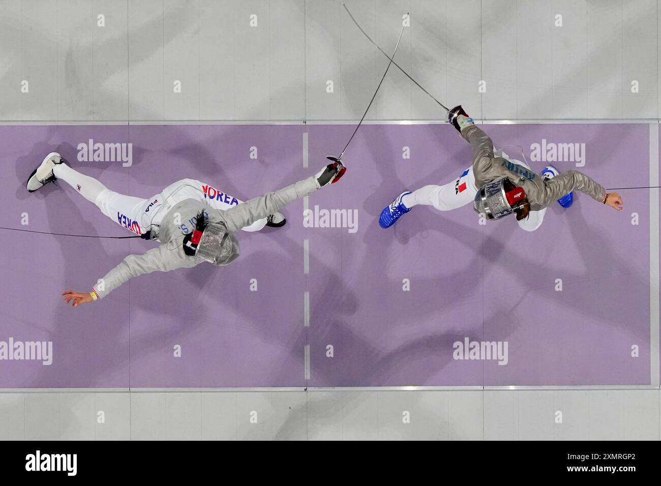 South Korea's Choi Sebin, left competes with France's Manon Apithy ...