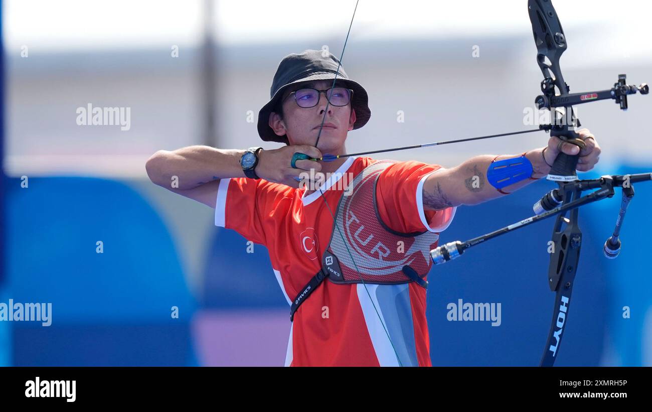 Turkey's Mete Gazoz shoots during the men's team semifinals Archery ...