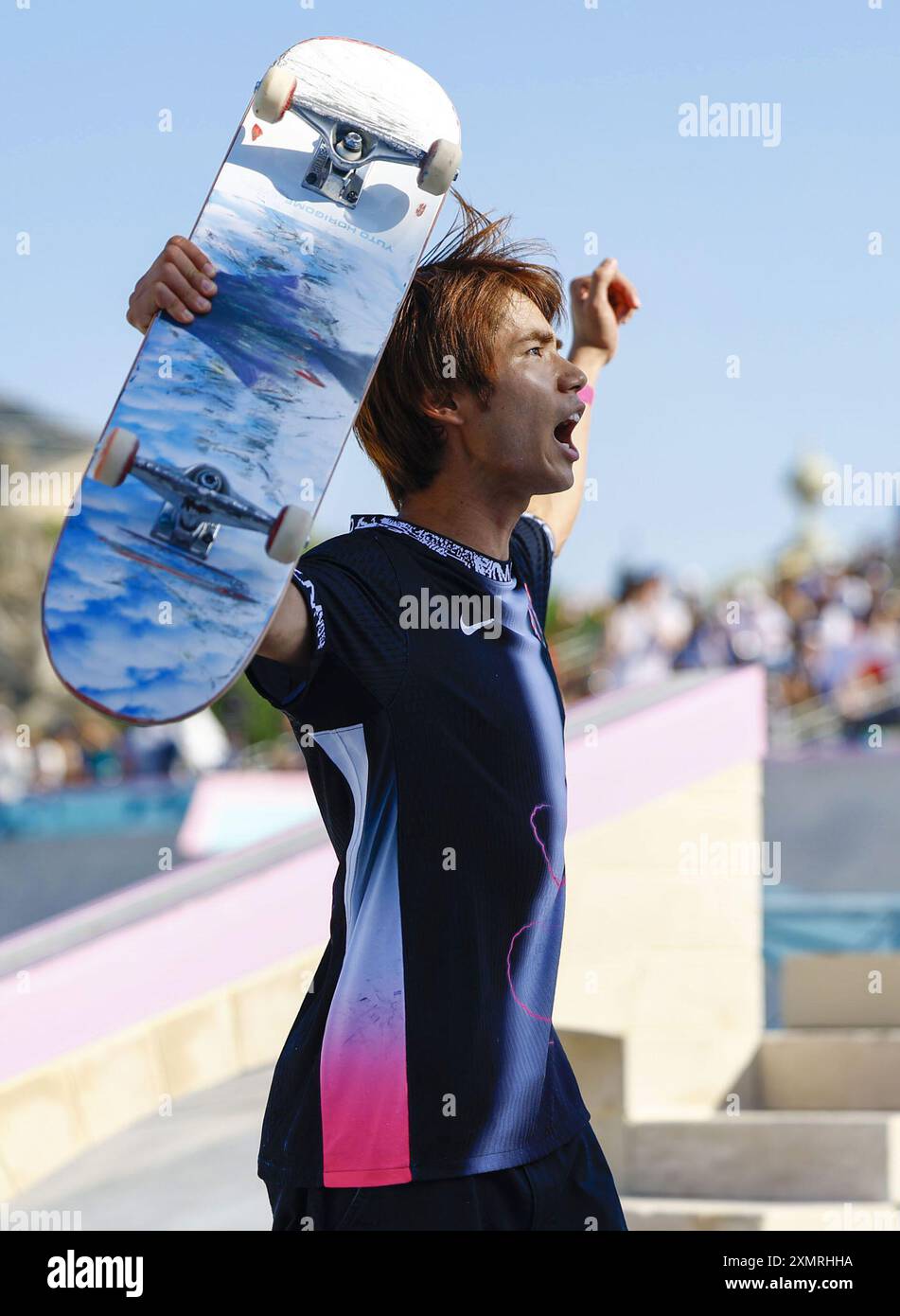 Yuto Horigome of Japan shouts after performing a trick in the men's ...