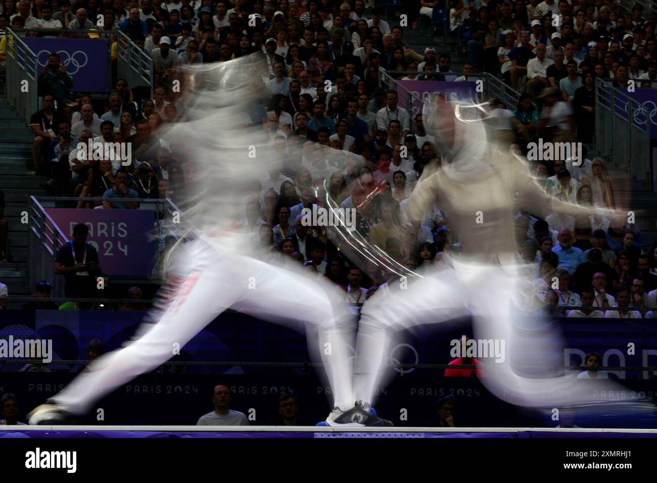 South Korea's Choi Sebin, left competes with France's Manon Apithy ...