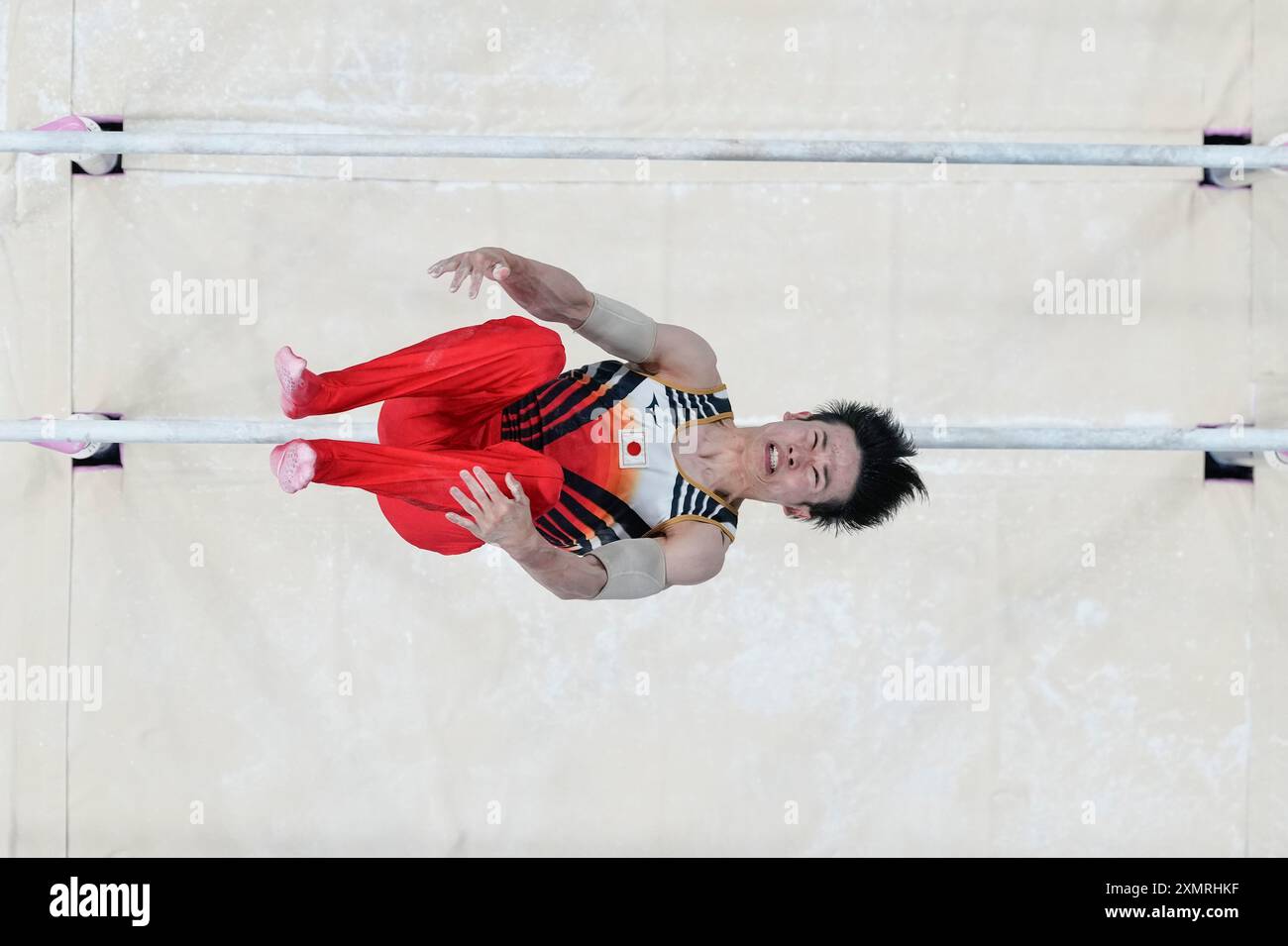 Kazuma Kaya of Japan performs on the parallel bars during the men's ...