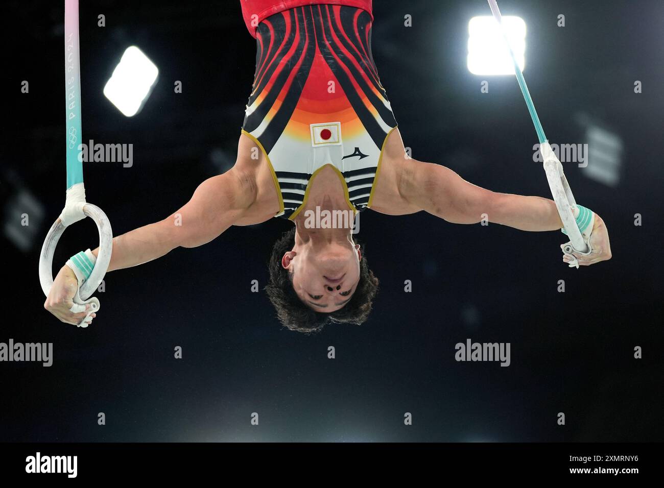 Shinnosuke Oka, of Japan, performs on the rings during the men's ...