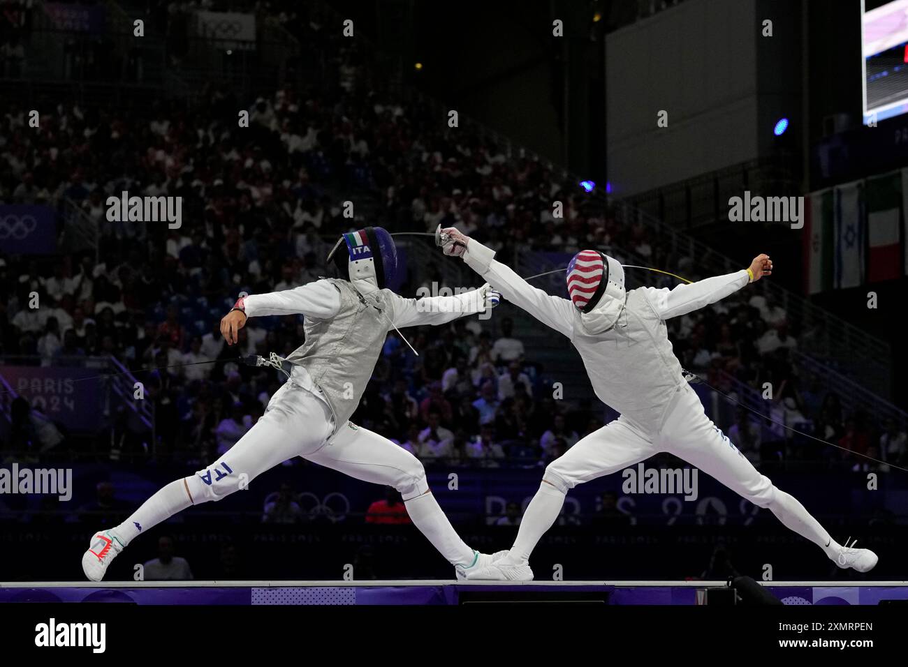 Italy's Filippo Macchi, left, competes with United State's Nick Itkin ...