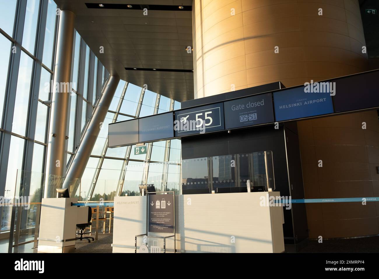 Empty Airport terminal check-in gate at sunrise Stock Photo - Alamy