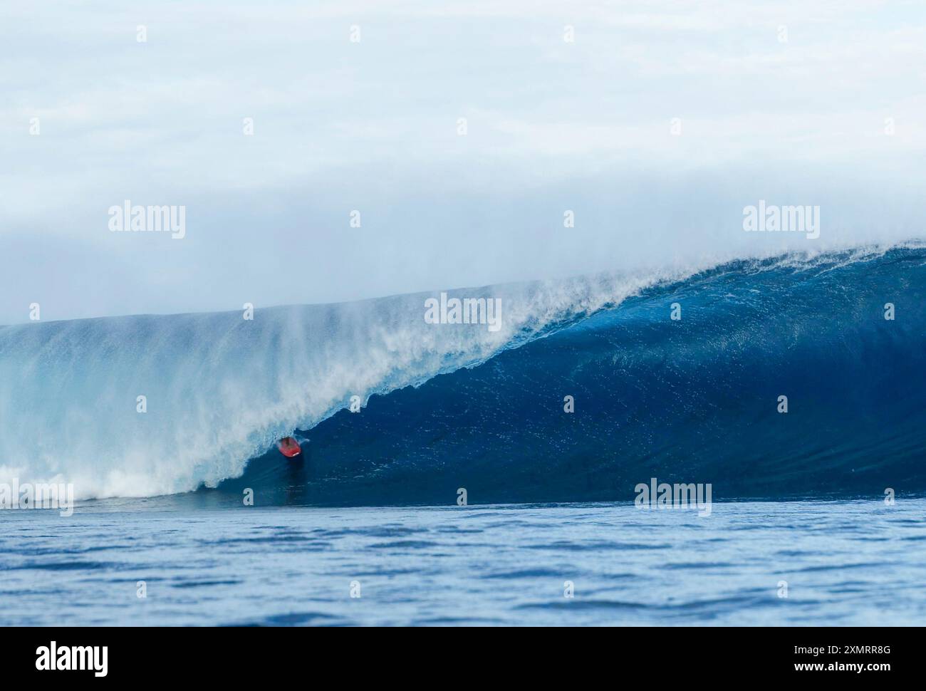 Japan's Reo Inaba drops into a barrel in the 2nd heat of the men's ...