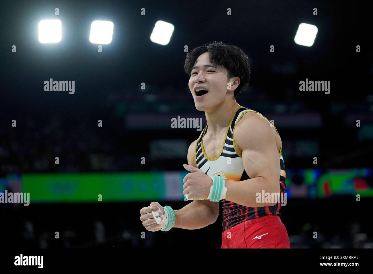 Shinnosuke Oka, of Japan, performs on the rings during the men's ...