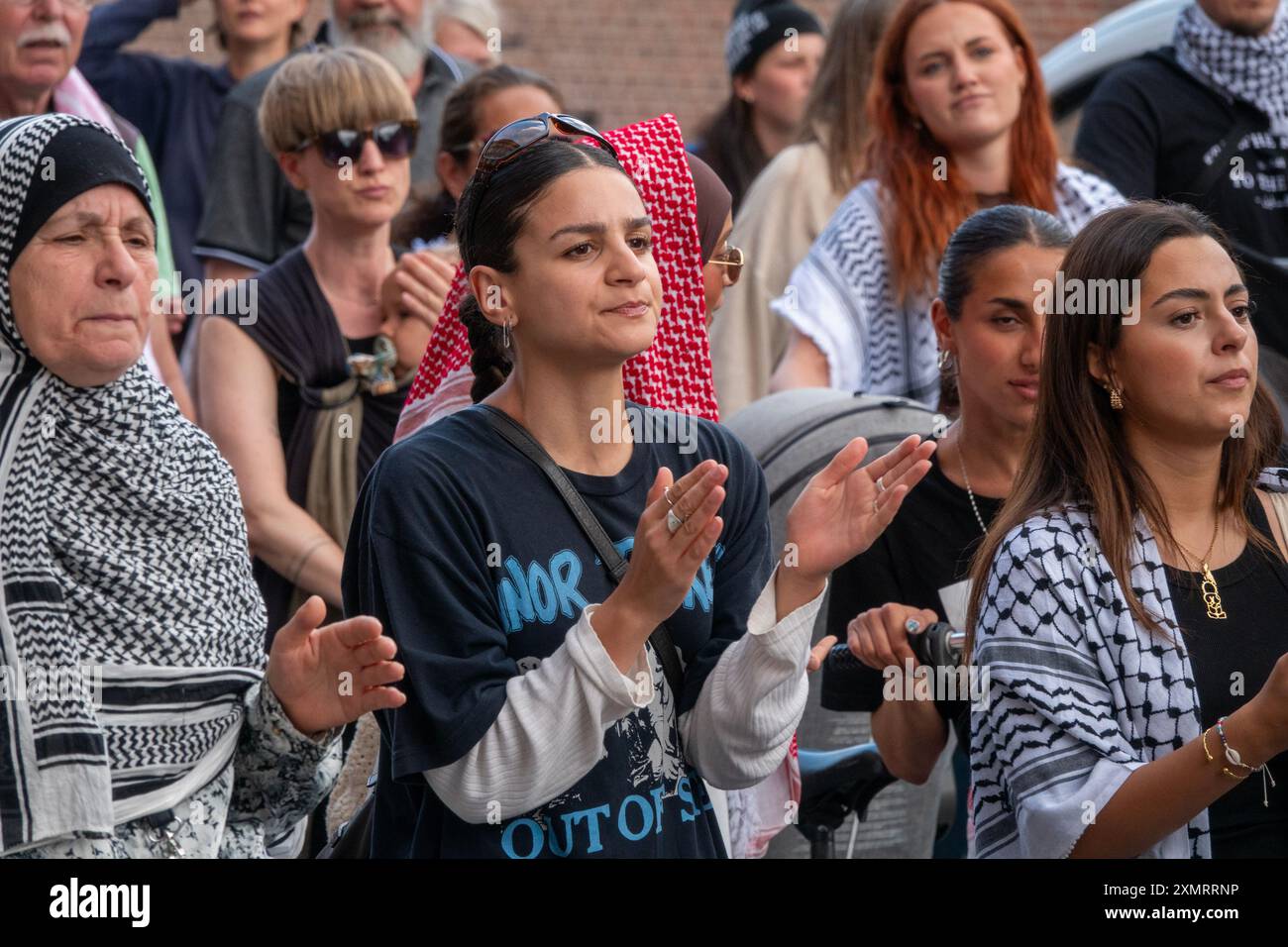 Crowd of people marching in demonstration in solidarity with Palestine ...