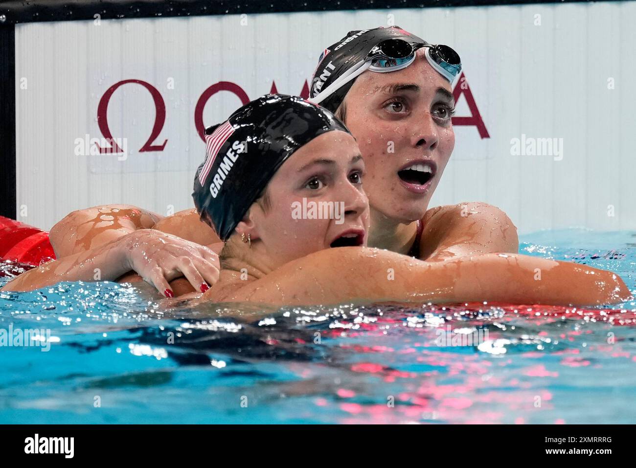Summer McIntosh, of Canada, hugs Katie Grimes, of the United States ...