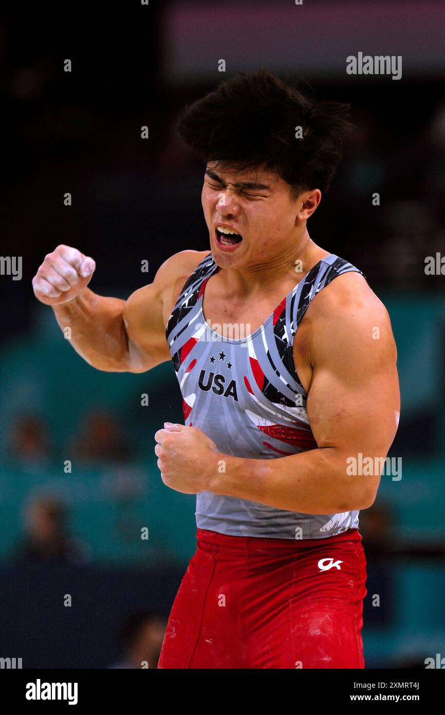 Asher Hong, of the United States, celebrates after performing on the ...