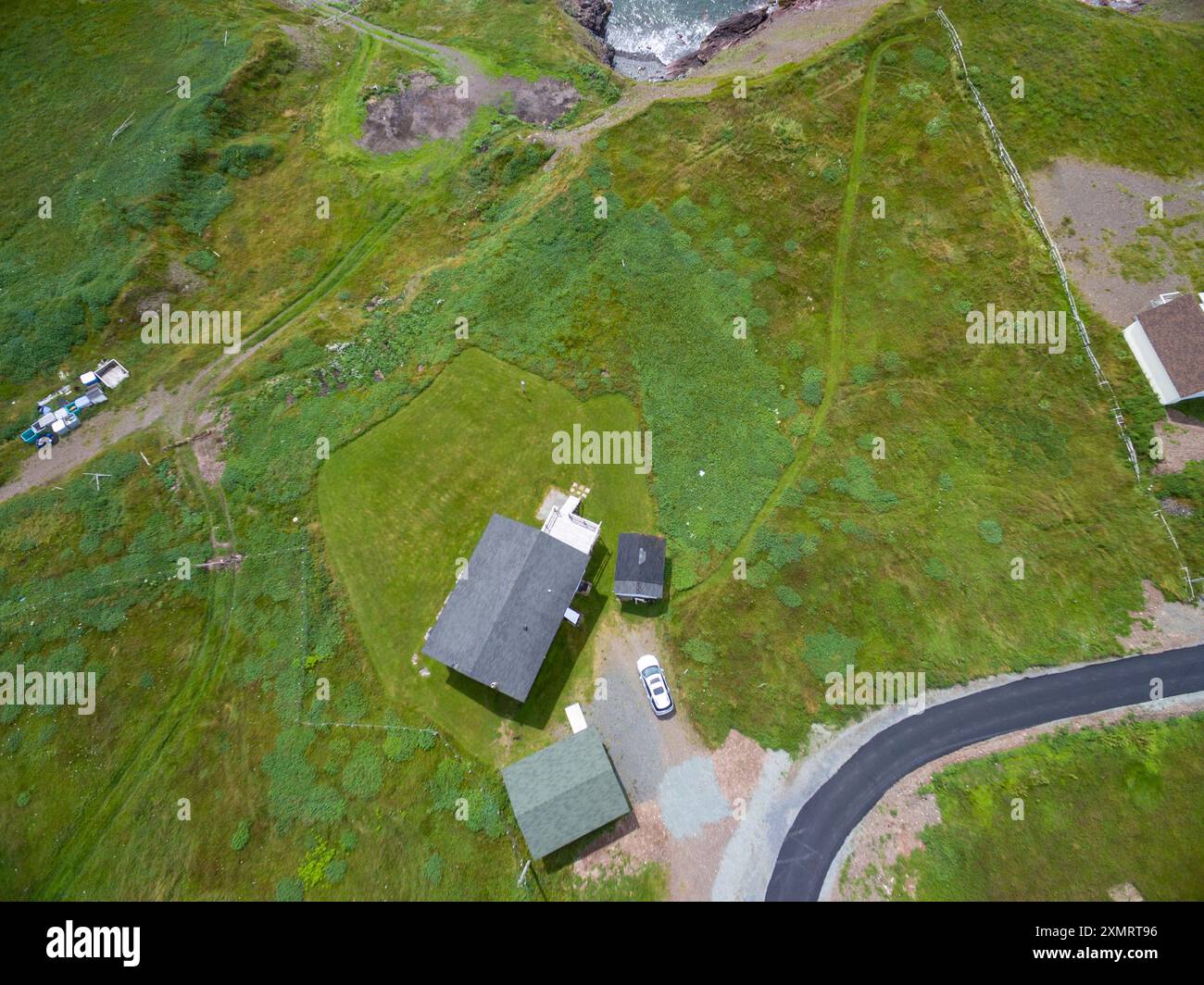 Aerial view of house, land, road, vehicle, and ocean, St. Bride’s ...