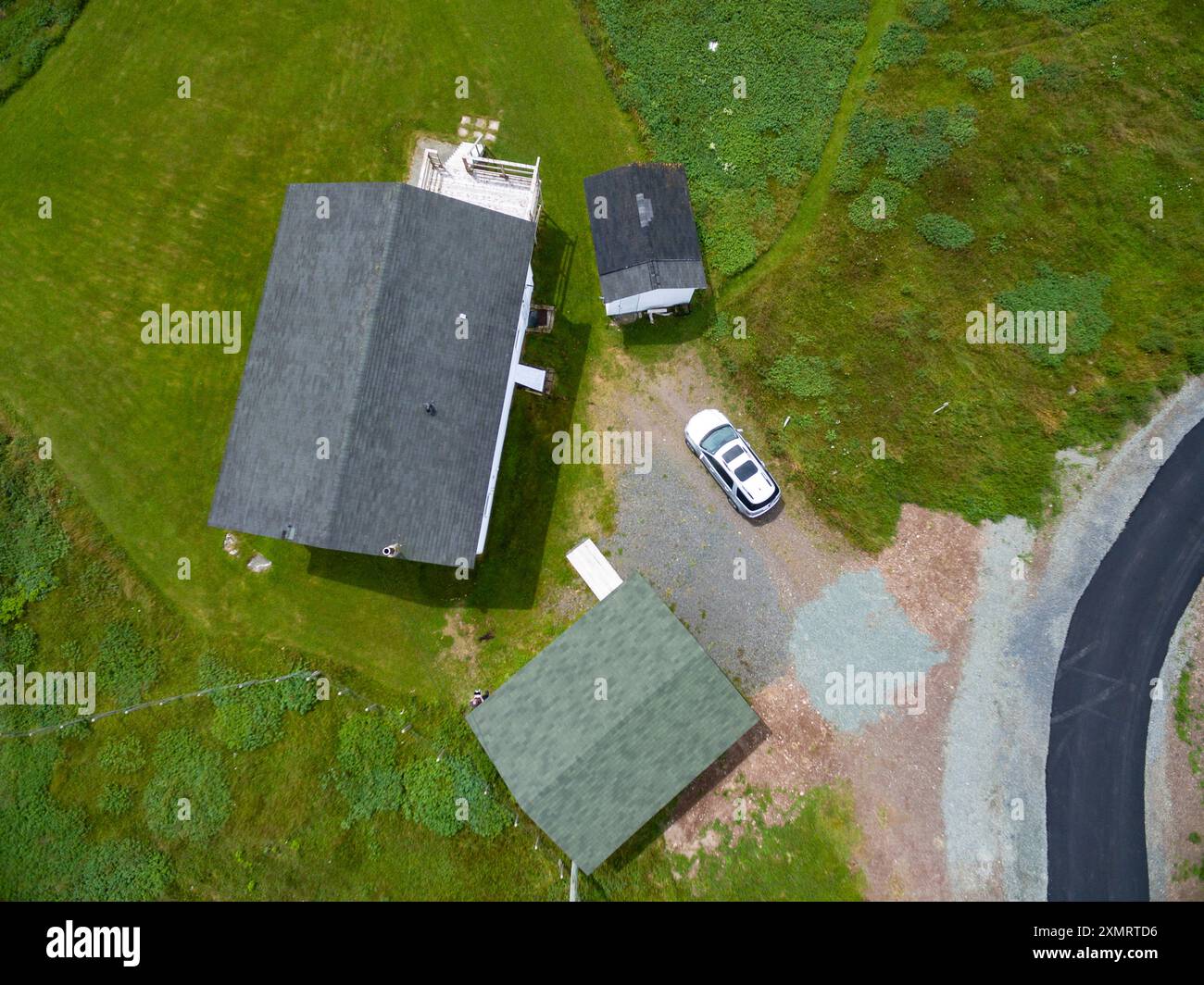 Aerial view of house, land, road, vehicle, and ocean, St. Bride’s ...