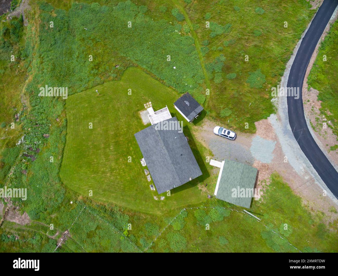 Aerial view of house, land, road, vehicle, and ocean, St. Bride’s ...