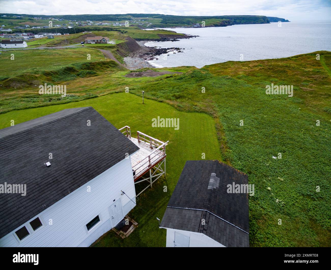 Aerial view of house, land, road, vehicle, and ocean, St. Bride’s ...