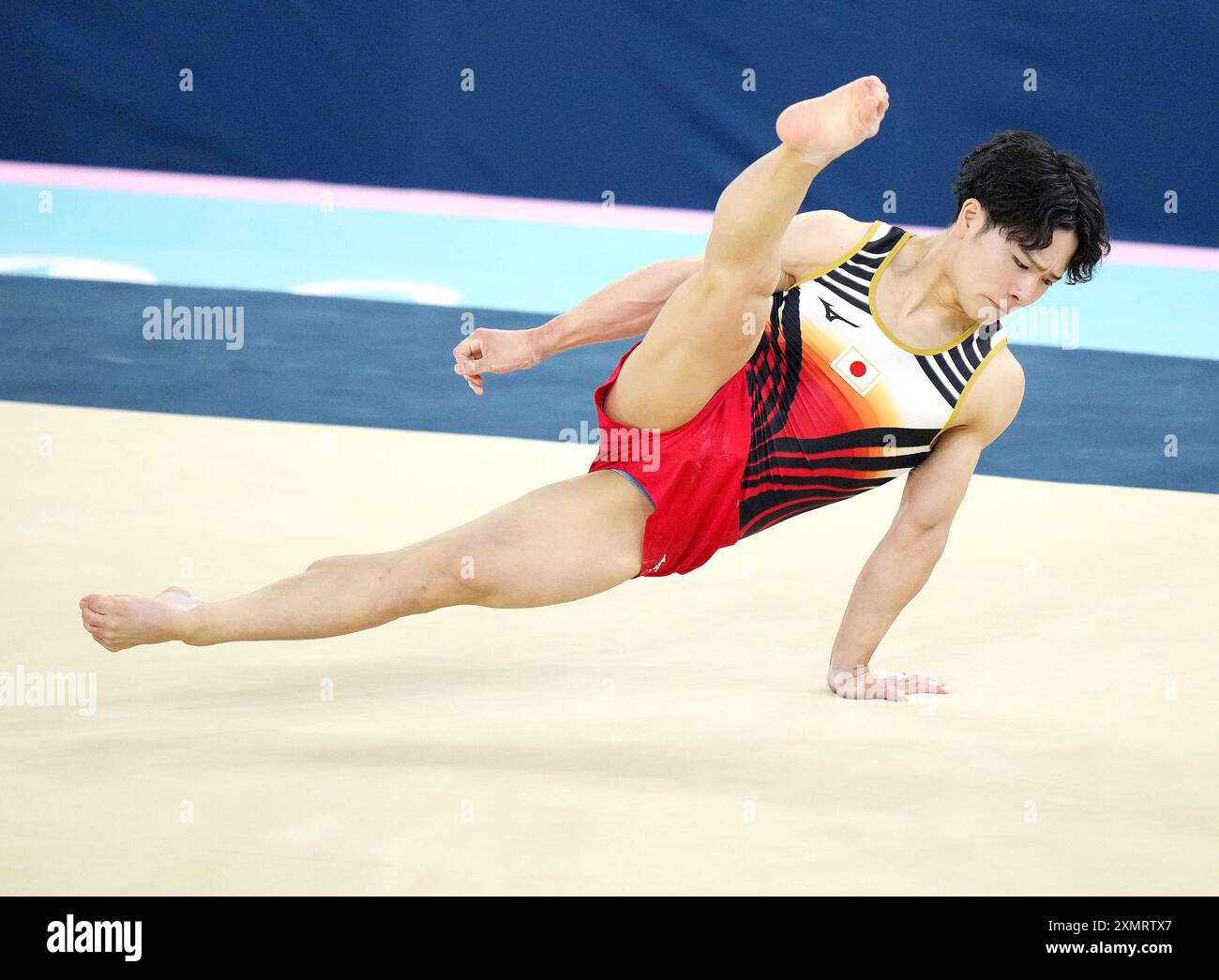 Shinnosuke Oka of Japan performs on the floor exercise during the men's ...