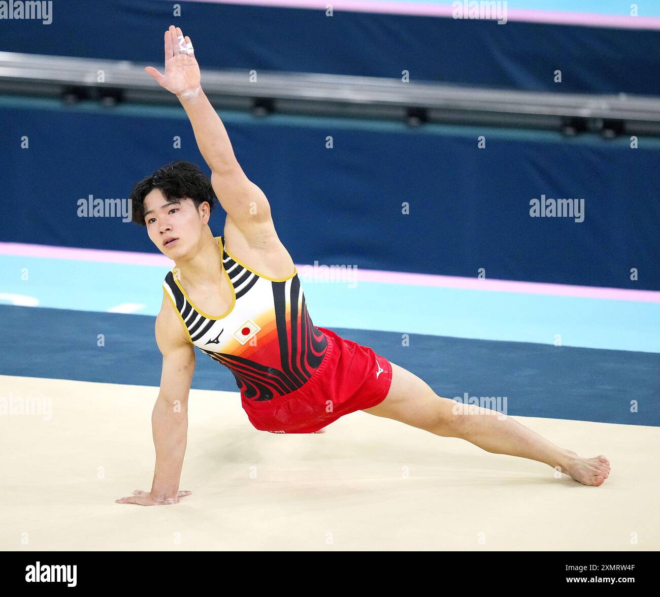 Shinnosuke Oka of Japan performs on the floor exercise during the men's ...