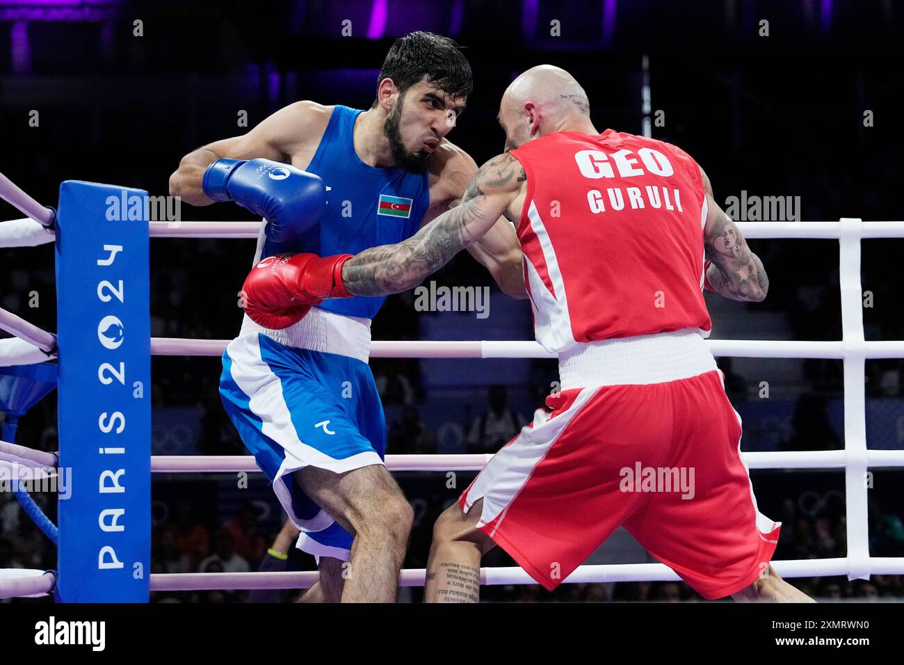 Georgia's Lasha Guruli, right, fights Azerbaijan's Malik Hasanov in ...