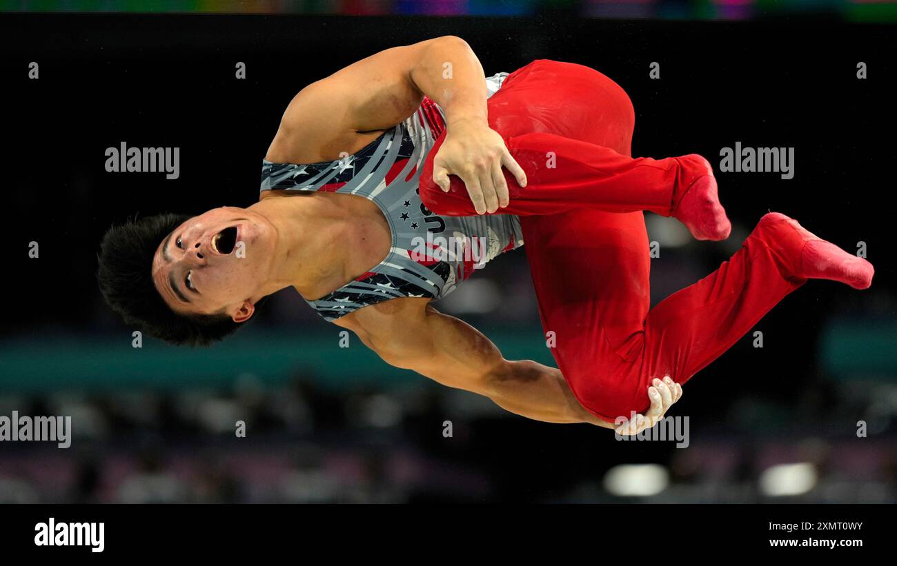 Asher Hong, of the United States, performs on the parallel bars during ...