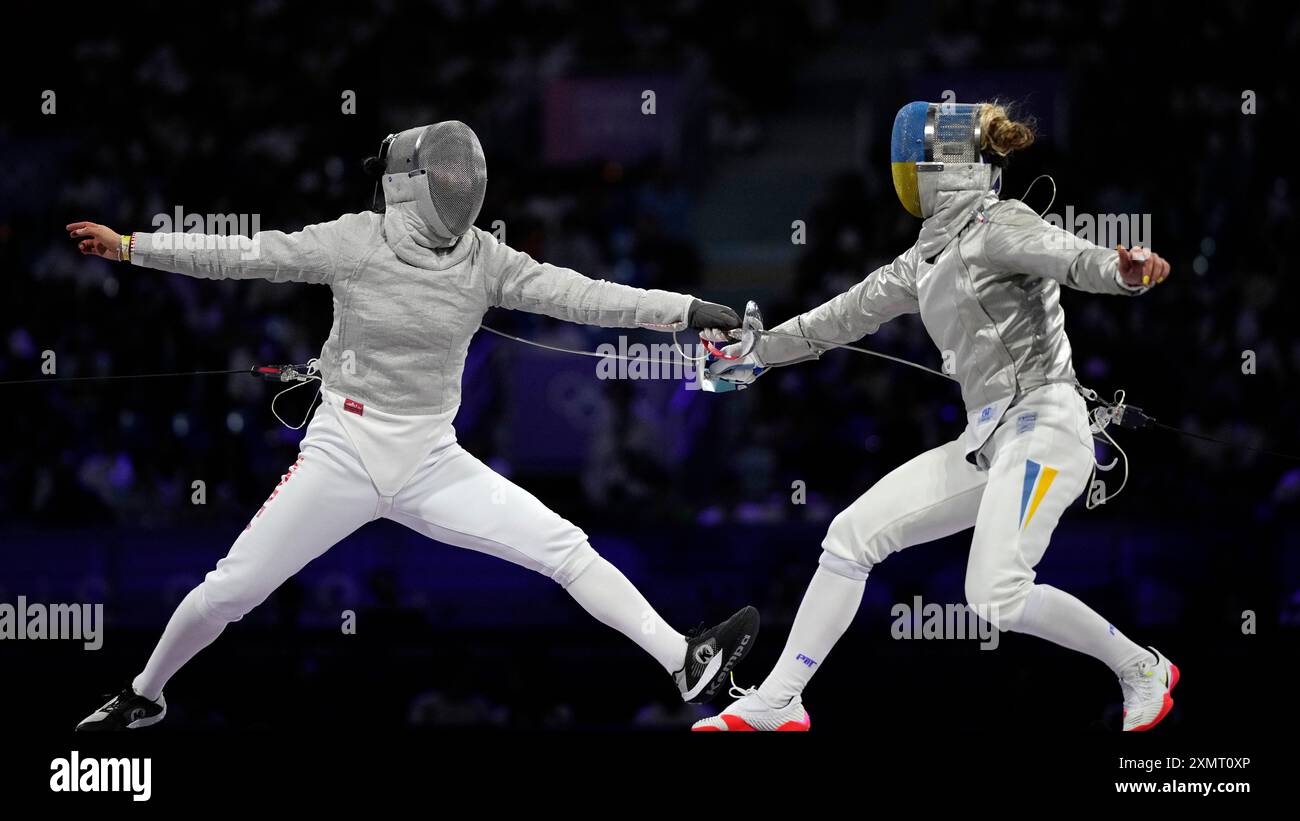 South Korea's Choi Sebin, left, competes with Ukraine's Olga Kharlan in ...